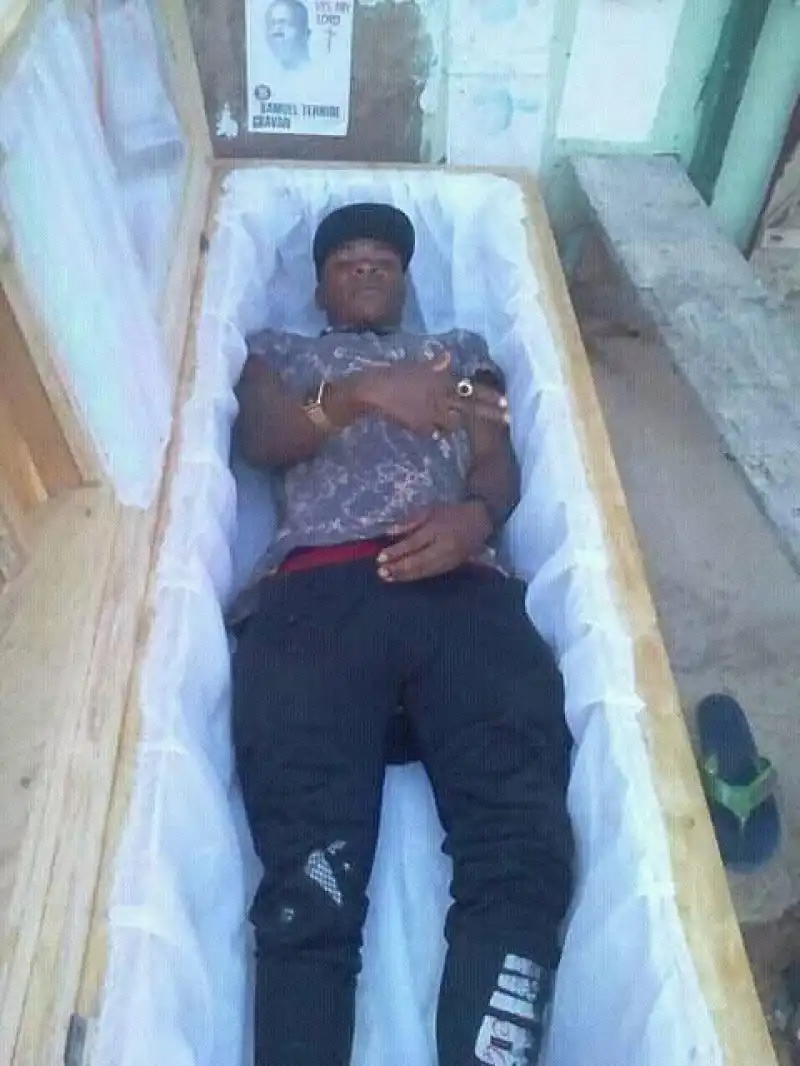 Photo Of A Man Posing Inside A Casket Sparks Outrage On Social Media ...